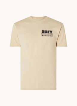 Obey Fight The System T-shirt met logo- en backprint • Zand ...